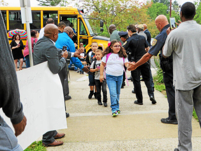 Volunteers welcome Morningside, Conte students to first day of school ...