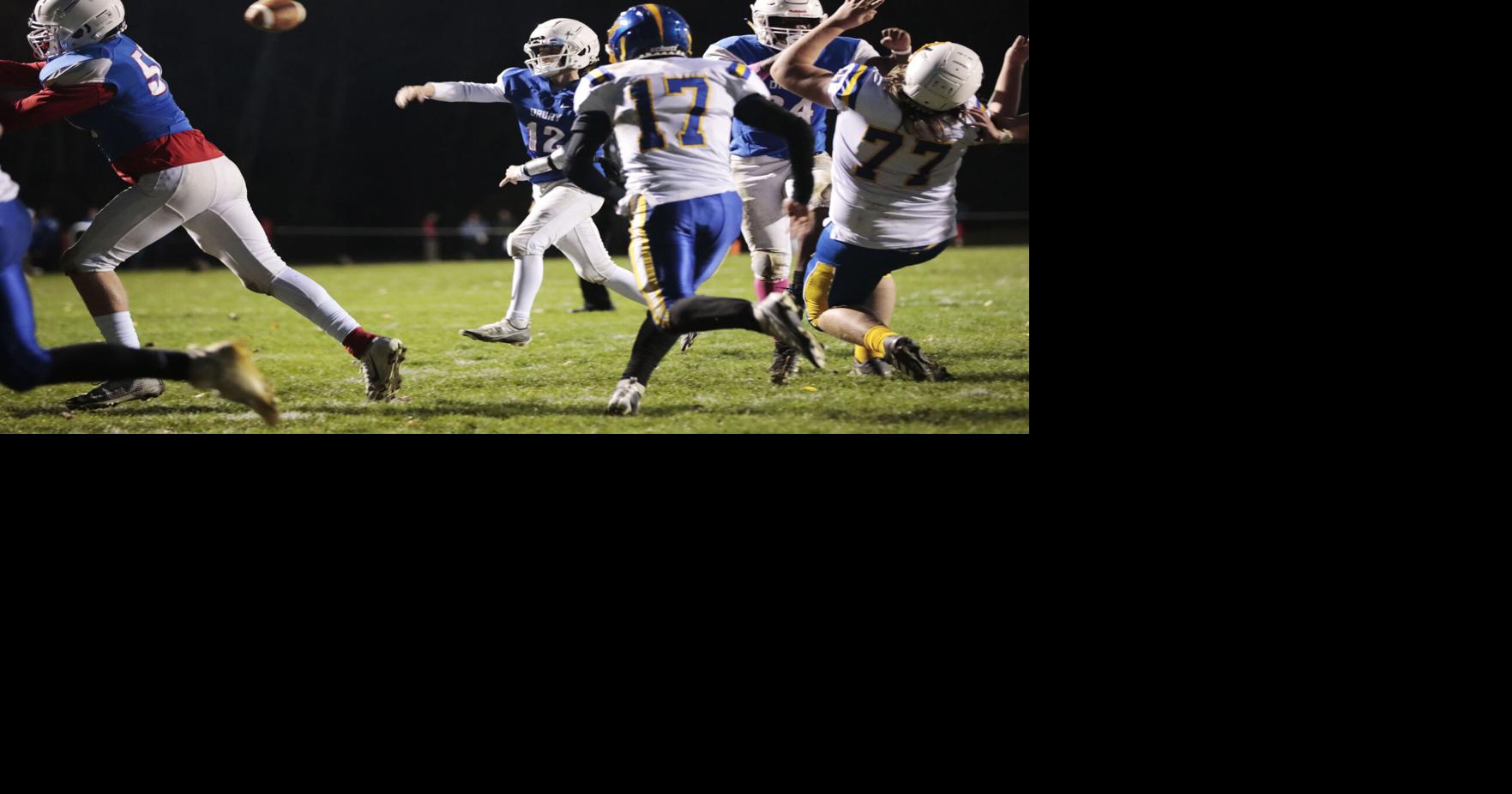 football player passes football in game | | berkshireeagle.com