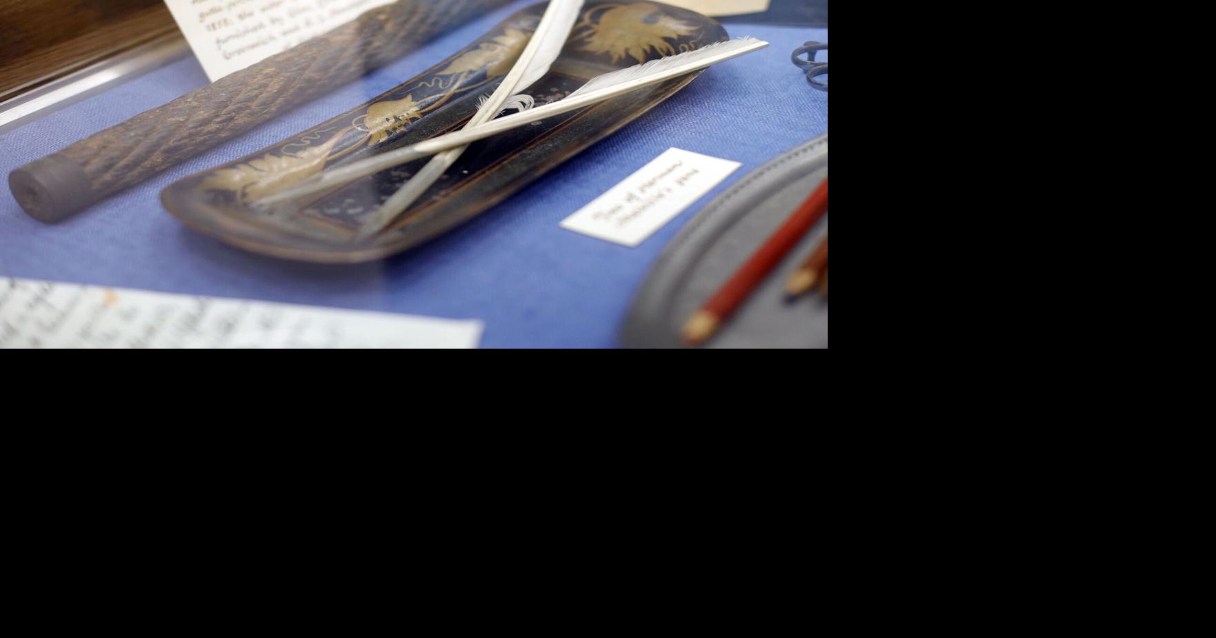 feather quill pens under display case | | berkshireeagle.com