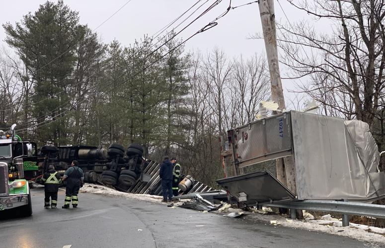 A tractor-trailer filled with sausages careens off an embankment at the ...