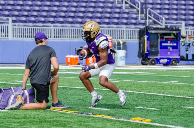 JMU football players shape up during spring football practice ...