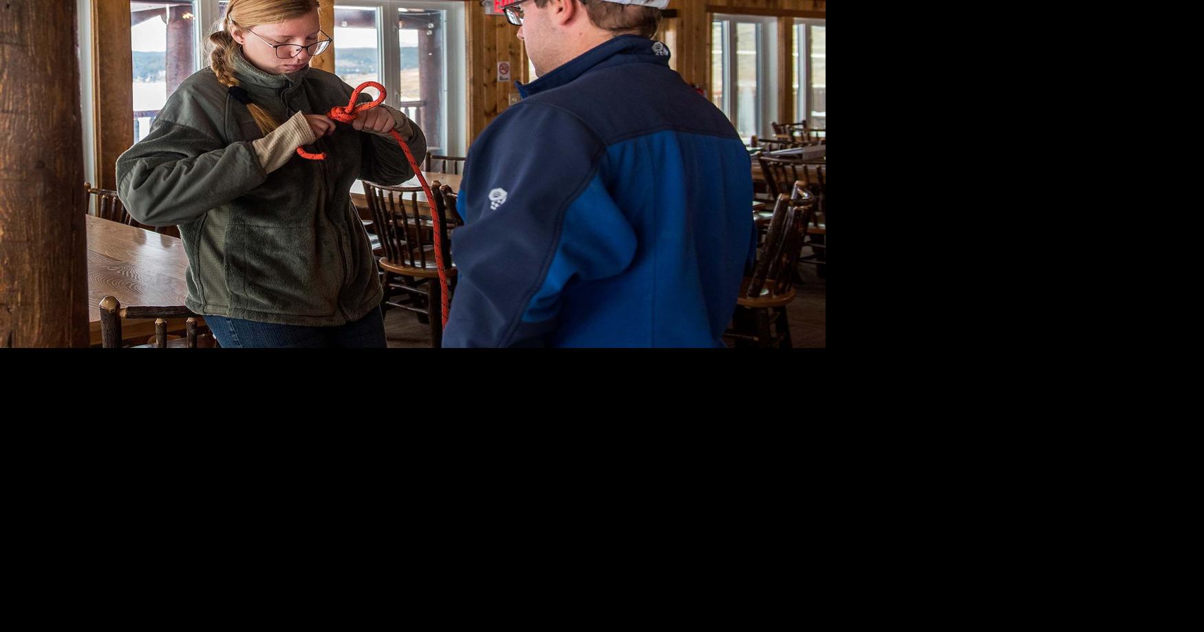 Chloe Barnum, right, assets Brendan Carr practice tying differnt knots ...