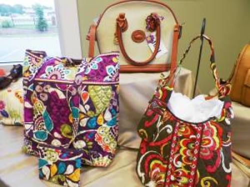 Women's fundraising cocktail party features purses, purses, purses ...