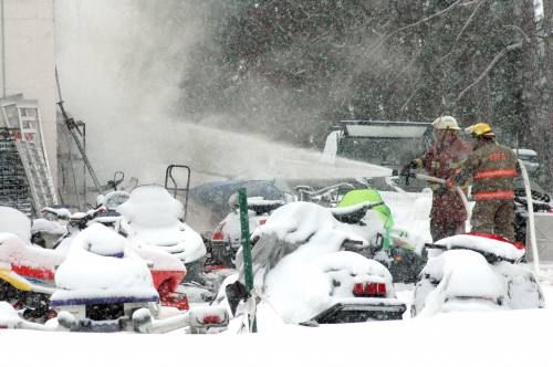 Man injured pushing burning snowmobile out of building | Local News ...