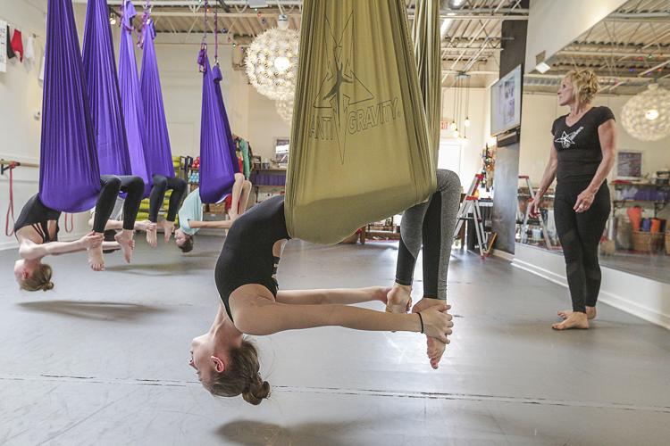 Art of anti-gravity fitness: Hammocks serve as cocoon to get you in ...