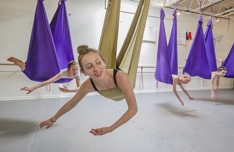 Art of anti-gravity fitness: Hammocks serve as cocoon to get you in ...