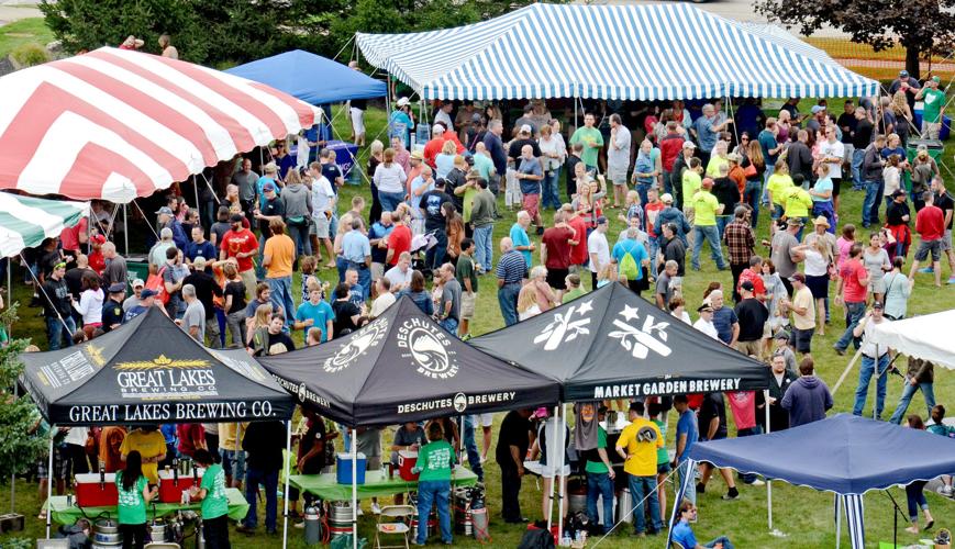 Crowd fills the grounds of the Eltech Building on 7th Avenue in Chardon ...