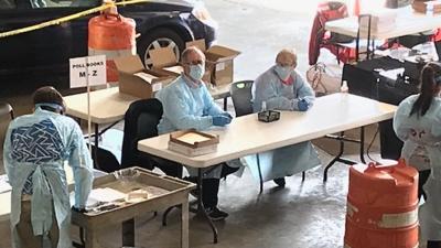 Speaker Vos responds to questions about his PPE while working polls ...