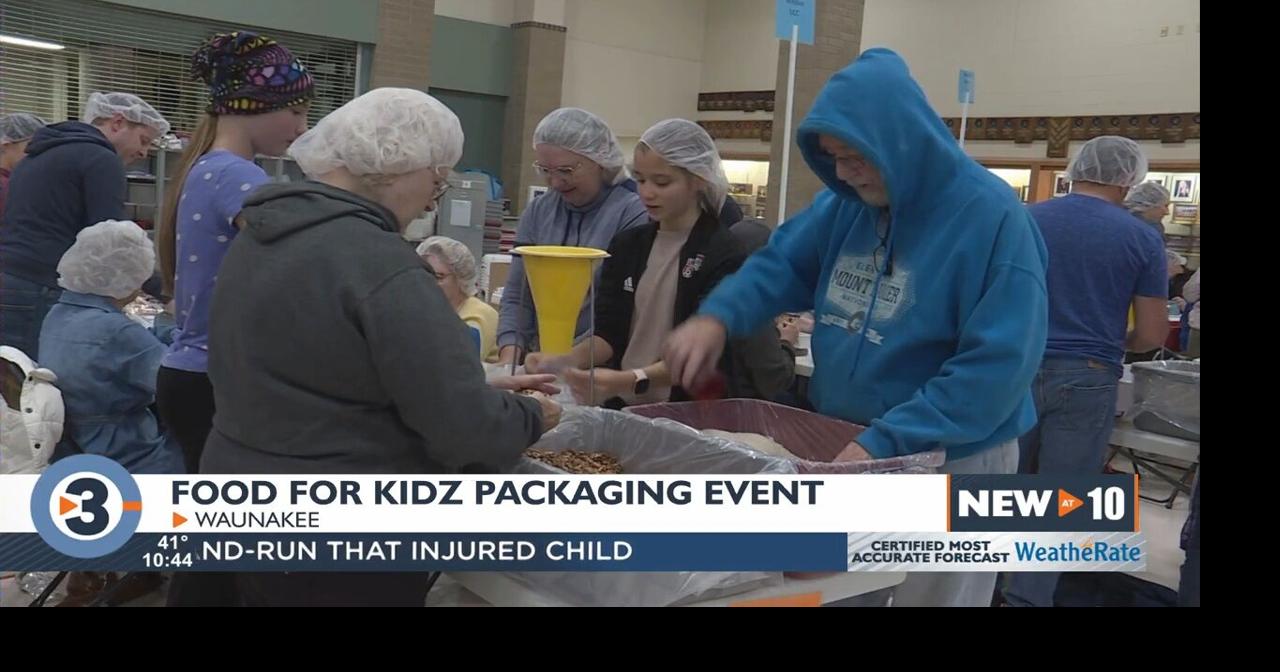 Food for Kidz volunteers pack meals for those in need at home and ...