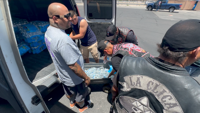 Local DJ hands out 1,600 water bottles to unhoused residents as ...
