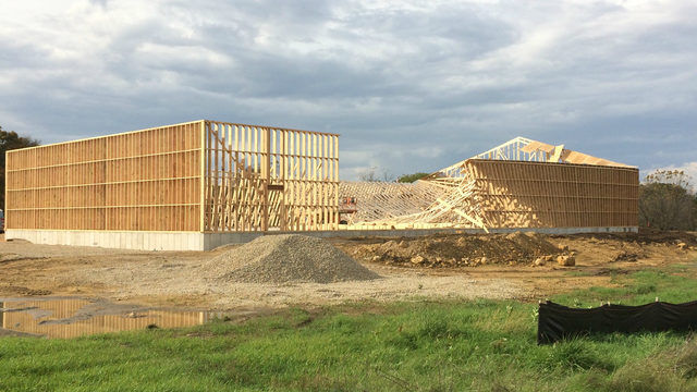 Construction worker injured after falling off roof when wooden building ...