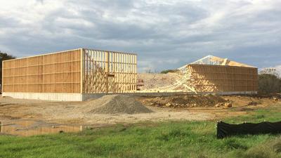 Construction worker injured after falling off roof when wooden building ...
