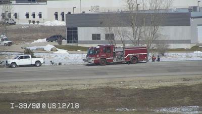 Fire crews work to rescue driver pinned inside vehicle after interstate ...