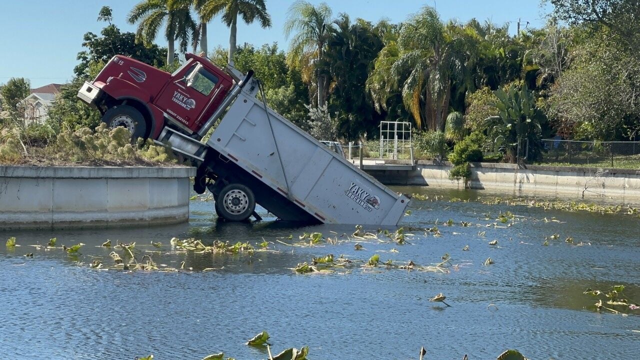 'You don't see this every day': Construction truck falls into Florida ...