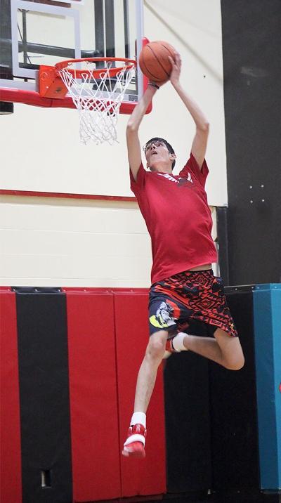 Dunk artist Isaac Fisher hopes to inspire youth | News | charkoosta.com