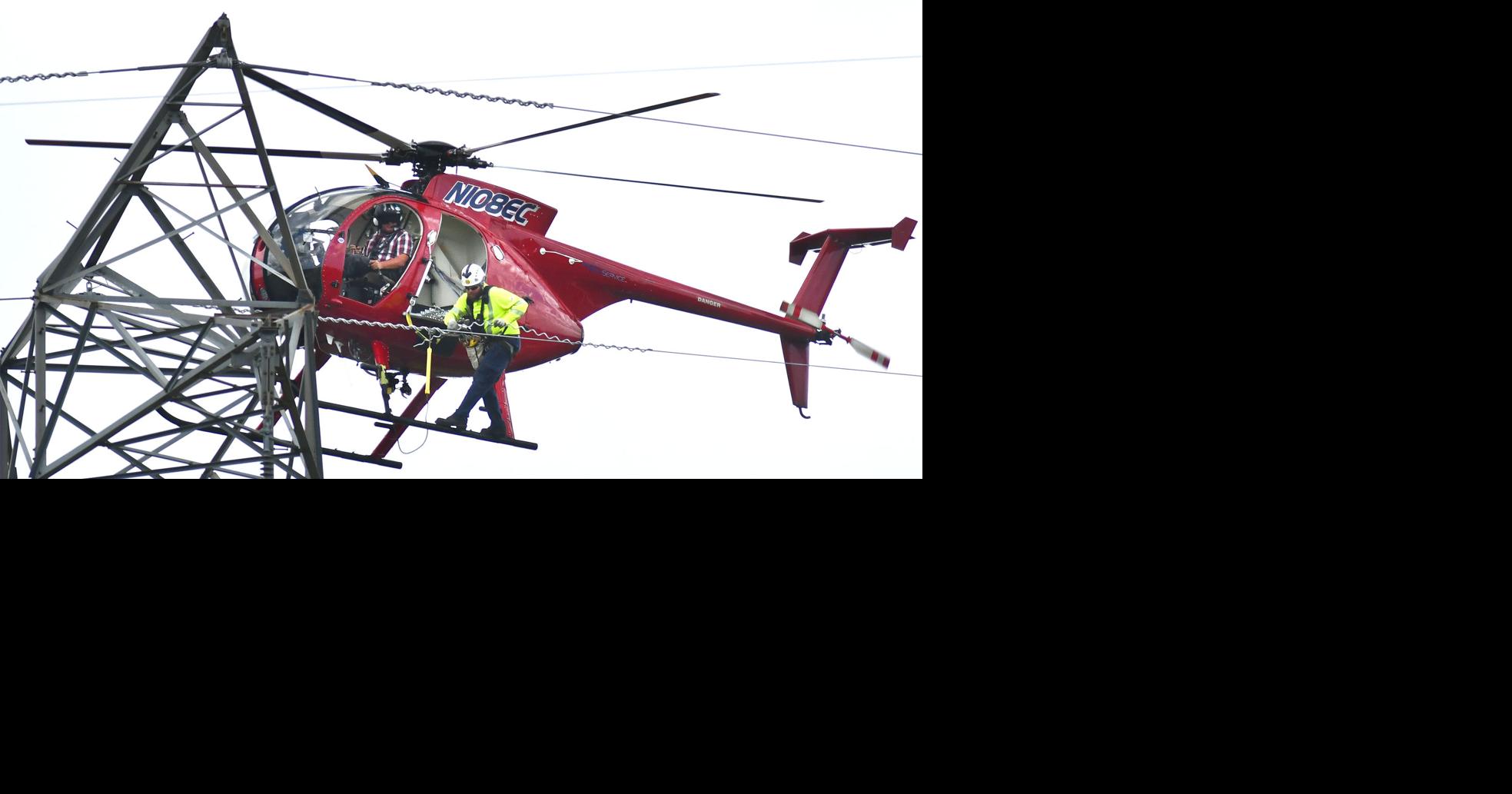 Lineman descends from helicopter to work on power lines | Local News ...