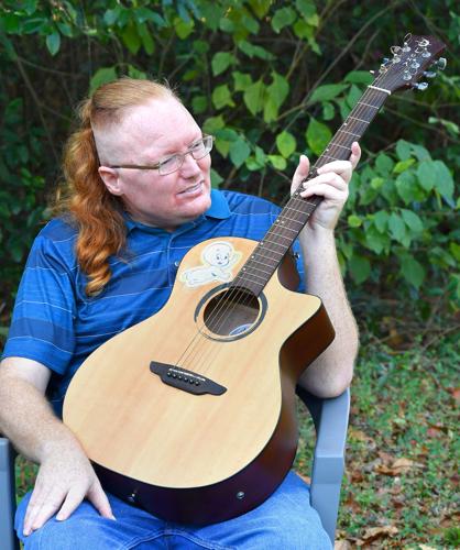 Man with Asperger Syndrome uses his art and music to spread awareness ...