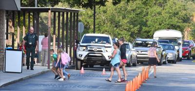 New cellphone law requires motorists to be hands-free through school ...