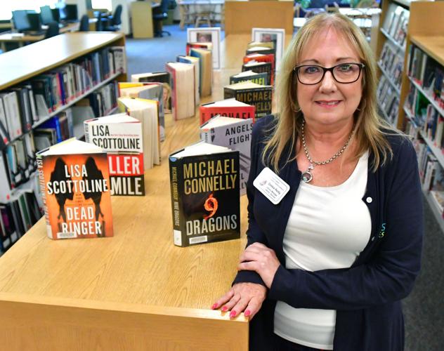 Forever in service: Navy veteran turned library manager serves country ...
