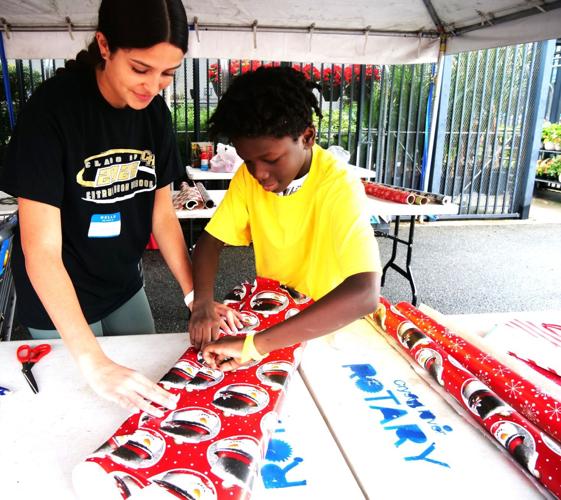 Citrus County Rotary clubs help children shop for Christmas | Local News | chronicleonline.com