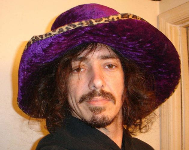 The man in the purple hat turns out to be local woman’s long, lost ...