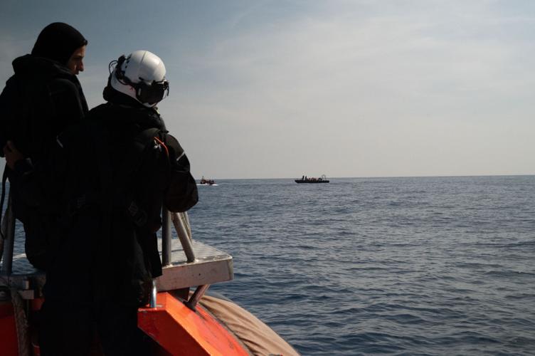 Aid group says Libyan-linked vessels fired on a migrant rescue ship in ...