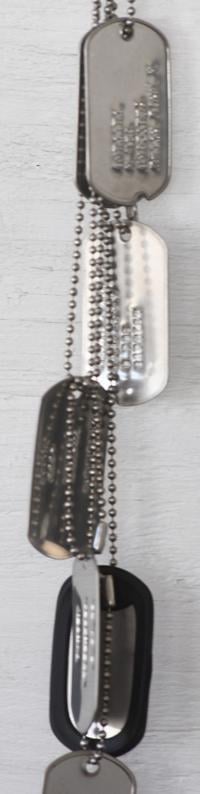 Local couple use vintage dog tag machine to craft tags for veterans ...