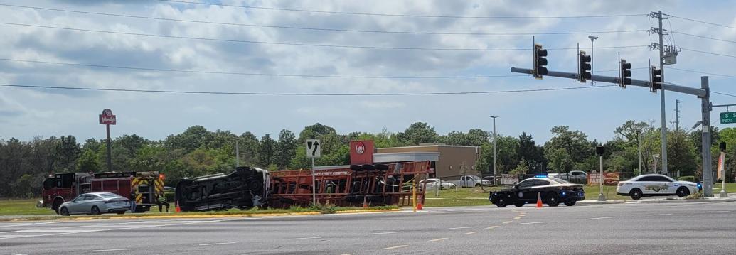 Pickup truck hauling vehicles overturns. Unsecured load believed ...