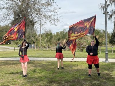 Bringing the fire: Crimson Fire Independent Winter Guard sharing their ...