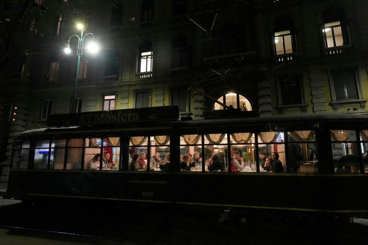 Milan’s historical trams at night as the city gears up for the Winter ...