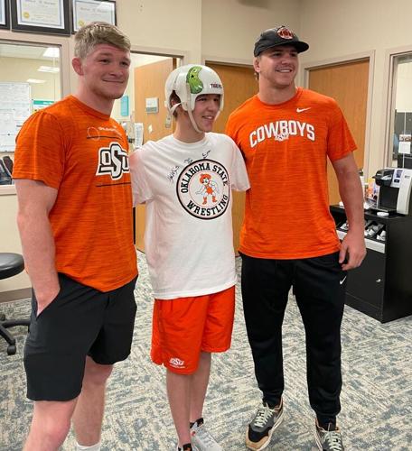 OSU wrestlers and trainers visit teenage wrestler in rehabilitation ...