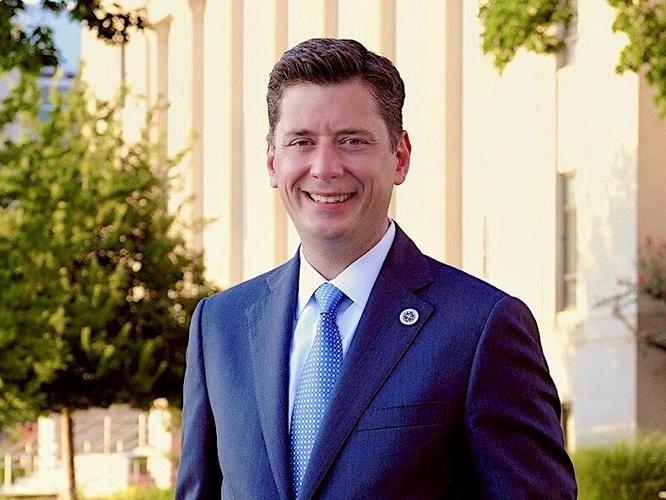 Oklahoma City Mayor David Holt, along with 50 other leaders, signs the ...
