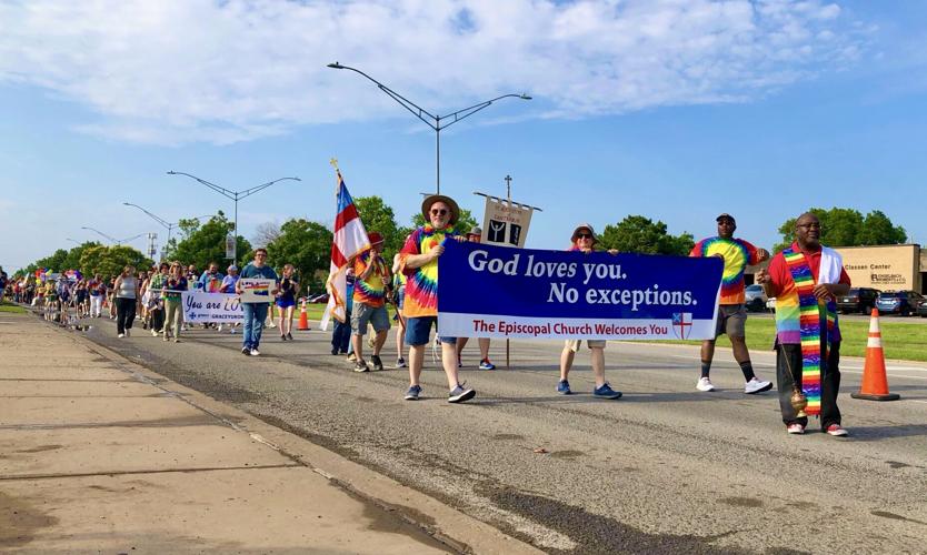 OKC Pride supporters step off together during 39th Street Pride Parade ...