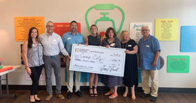 Hurricane Builders donates $1,500 to Camp Cole | Business | coladaily.com