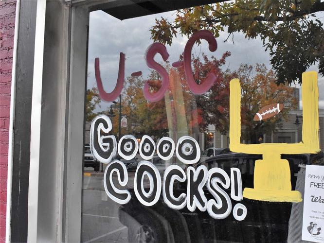 Store windows were painted by USC students in honor of homecoming week ...