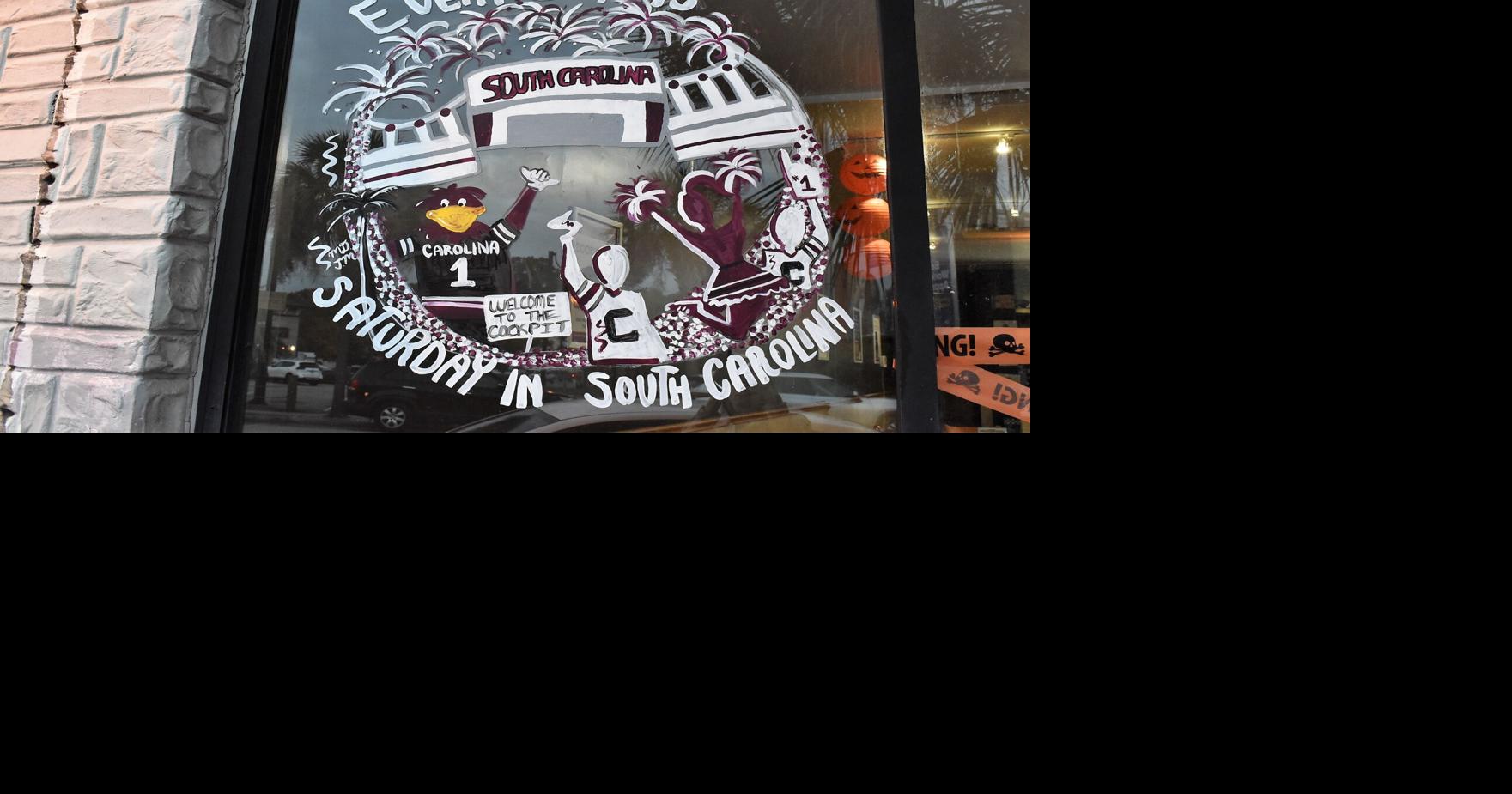 Store windows were painted by USC students in honor of homecoming week ...