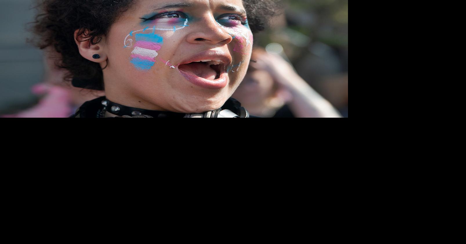 Dex Smith, a transgender man studying English at MU, yells a chant on ...