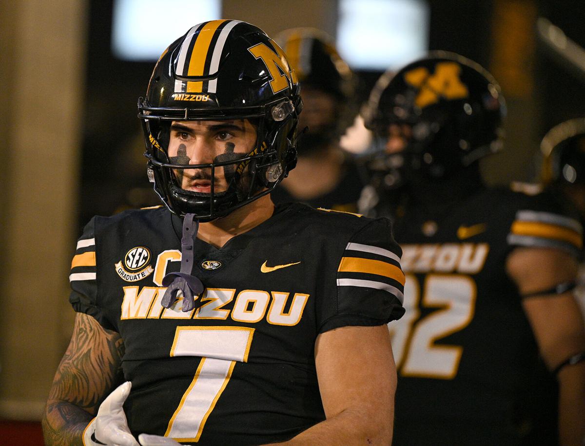 Mizzou running back Cody Schrader prepares to run onto the field ...