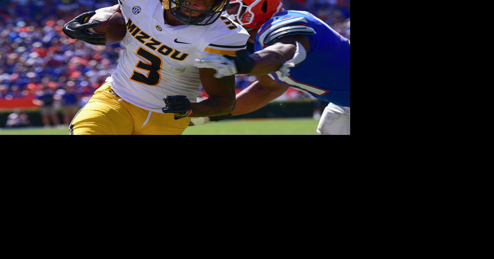 Missouri wide receiver Luther Burden tries to avoid tackle | Special ...