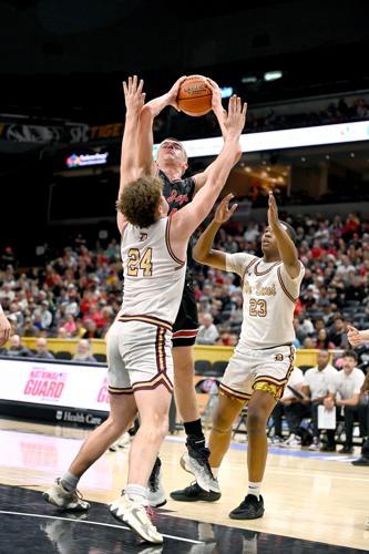 Jefferson City forward Nelson Shinkle goes for a basket | Sports ...