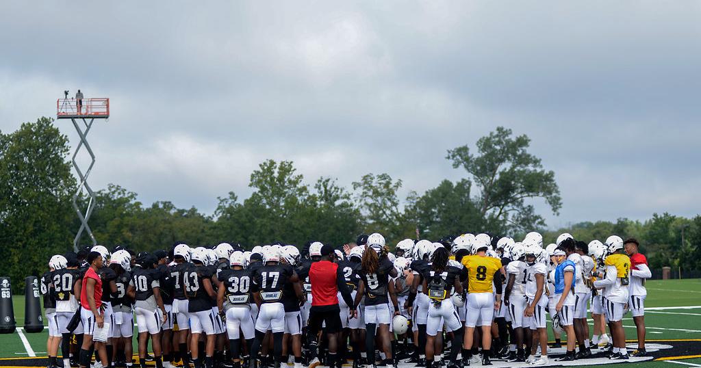 The University of Missouri football team congregates together at the ...