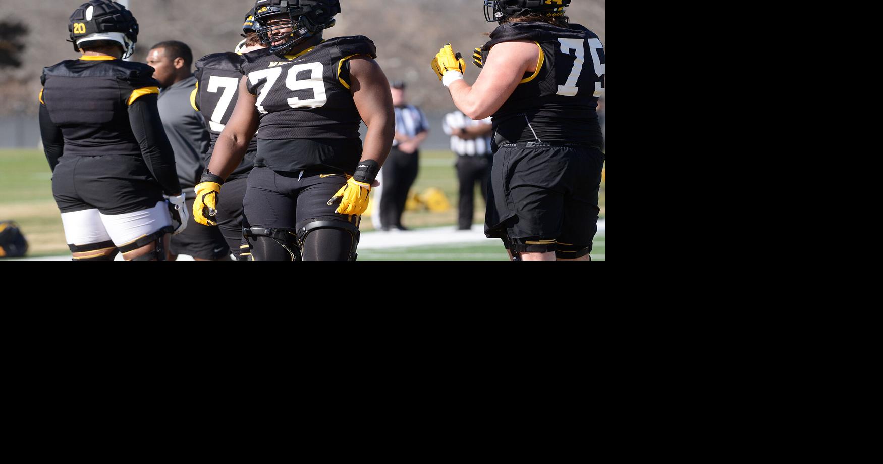 Armand Membou (79) and Mitchell Walters (75) finish offensive line ...