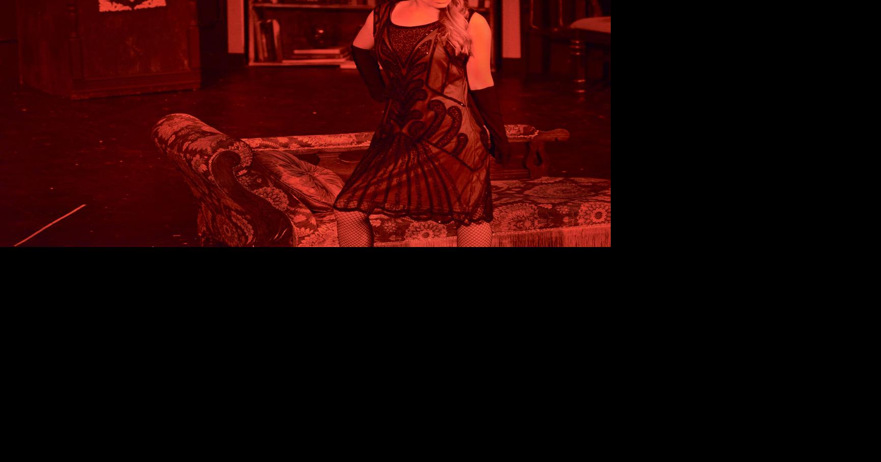 Reese Smith strikes a pose under the sudden red lighting ...