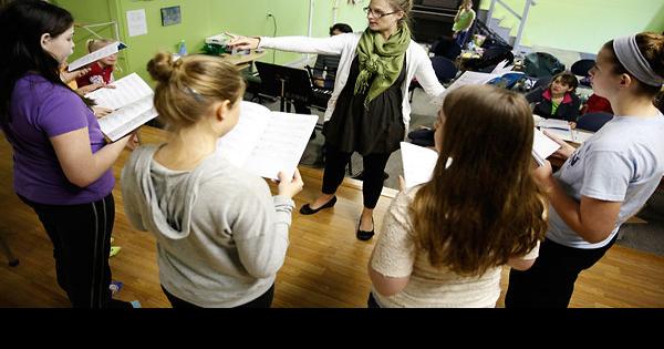Music teacher jumps through hoops to teach students piano and voice ...