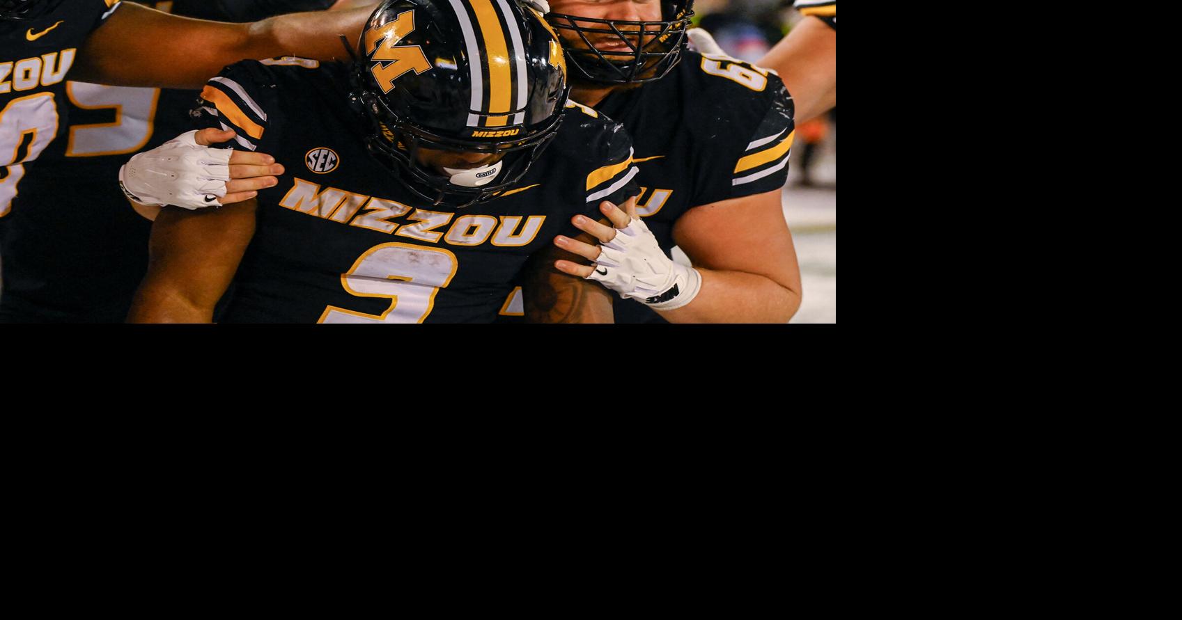 Mizzou running back Marcus Carroll celebrates with Mizzou center Drake ...
