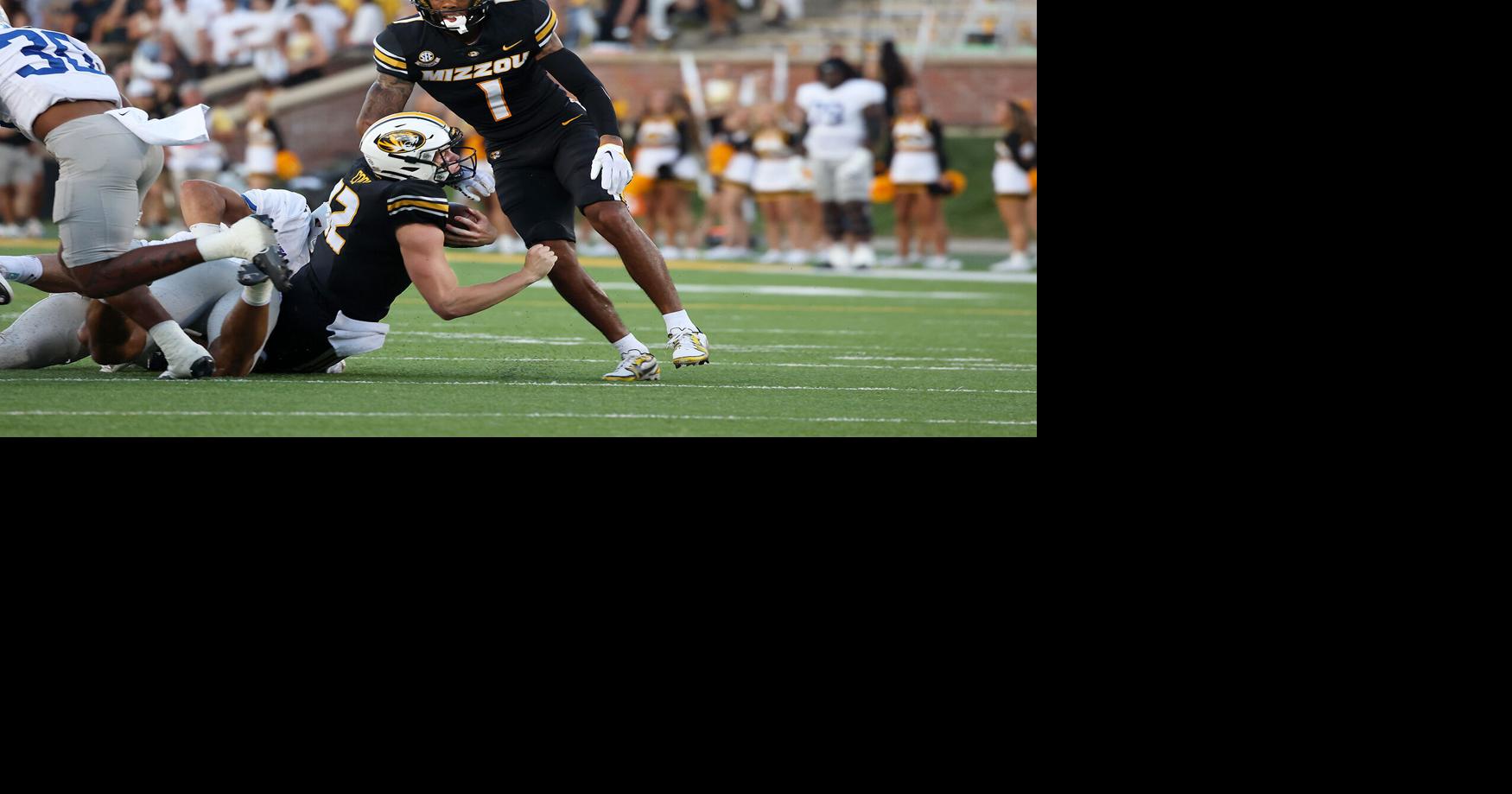 Mizzou wide receiver Theo Wease Jr. watches quarterback Brady Cook ...