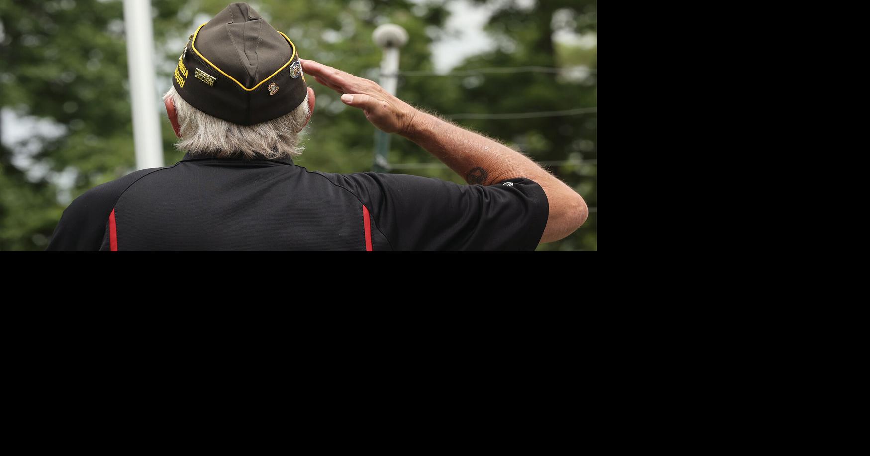Ed Miller salutes the American flag during the veterans dedication ...