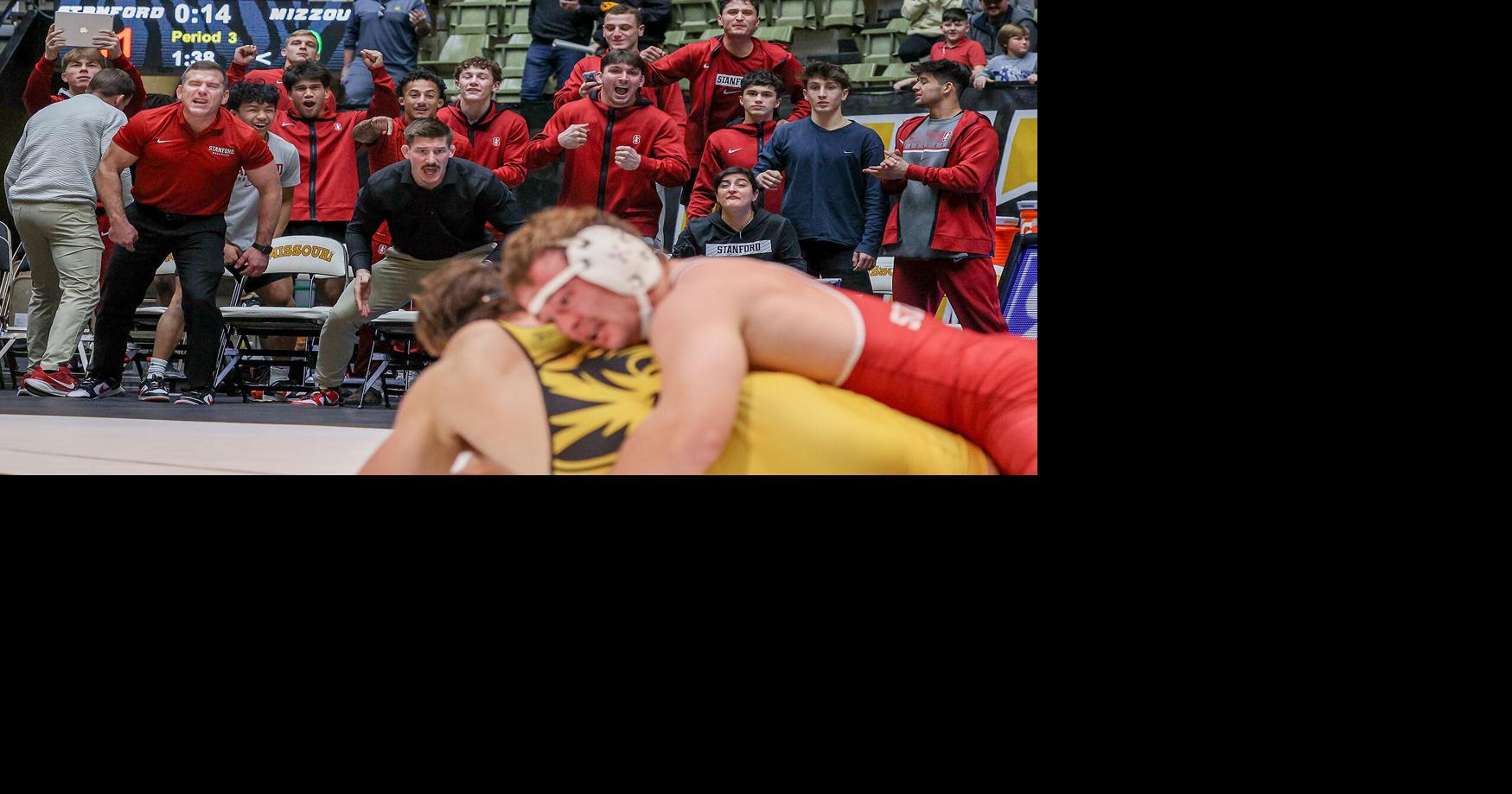 The Stanford wrestling team cheers on their teammate Peter Ming ...