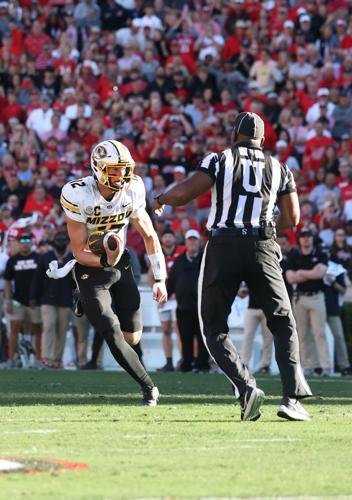 Mizzou quarterback Brady Cook runs to avoid a referee | Mizzou Football ...