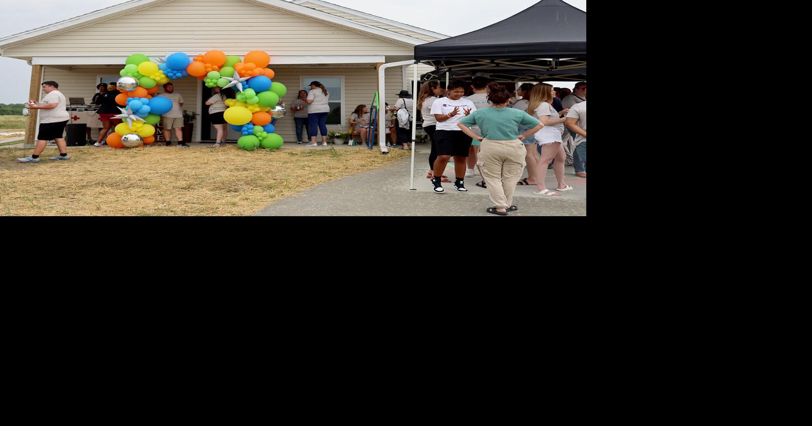 Rhonda Wyatt and her two teenage children celebrate moving into their ...